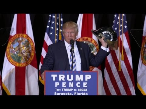 Trump receives firefighter's helmet at rally - The Global Herald