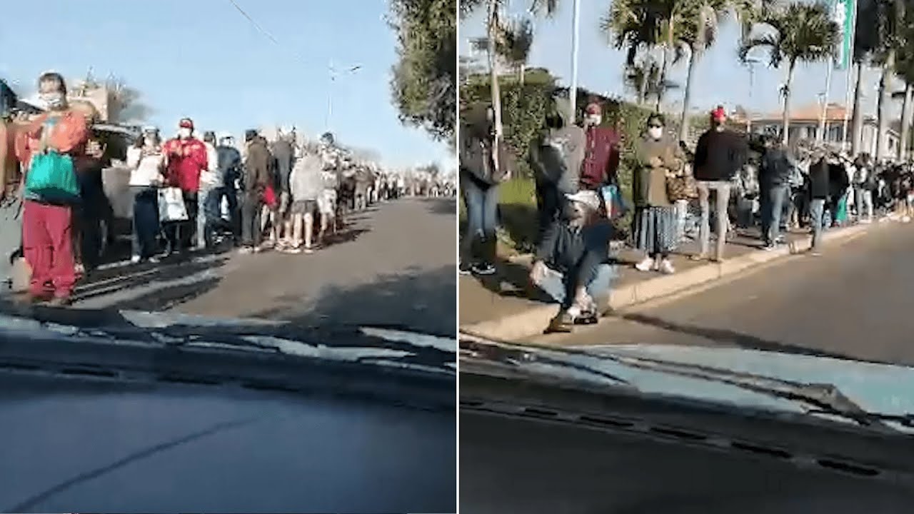 Watch - South Africa riots: Woman sobs as long queue of people forms to ...