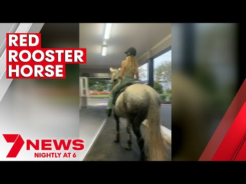 The moment a teenager rides through a Red Rooster drive-through on a ...