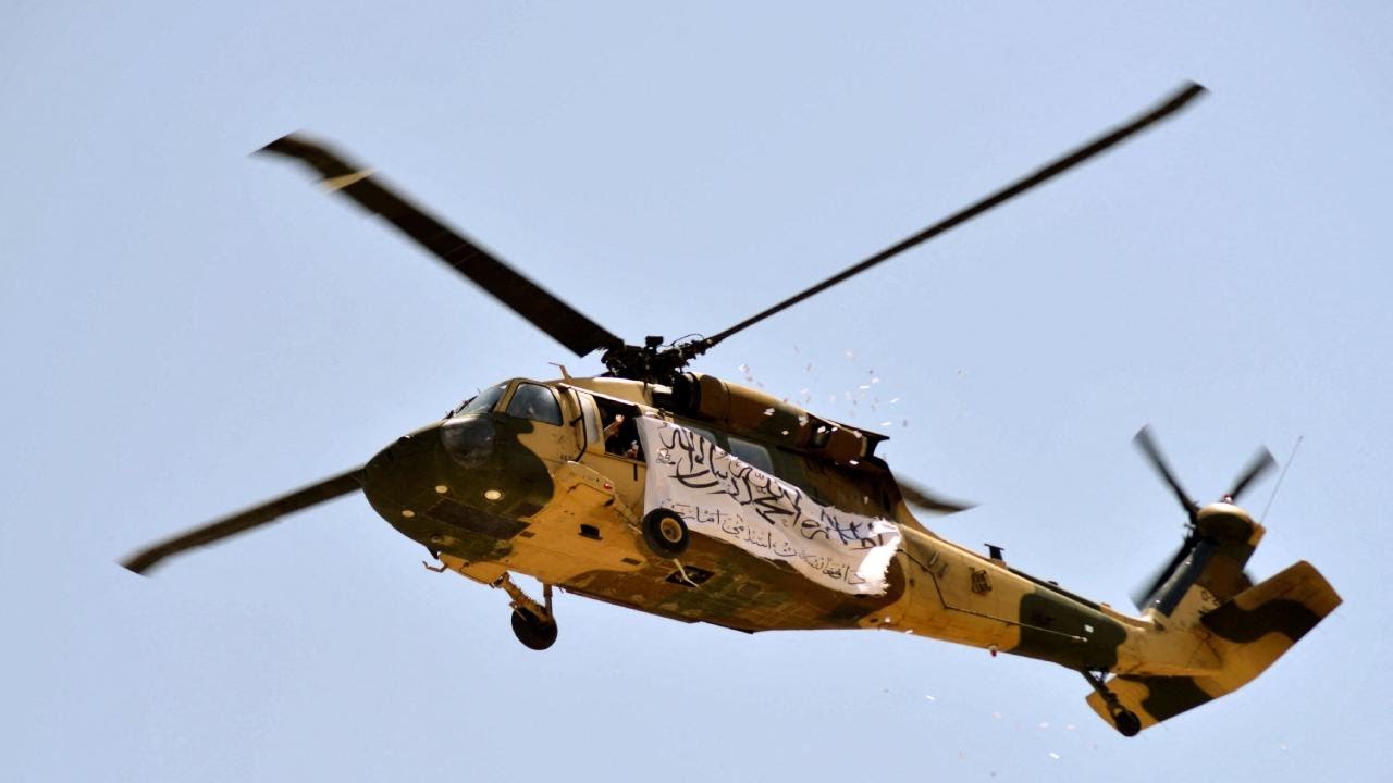 Taliban fly US Black Hawk helicopter above military parade in Kandahar ...