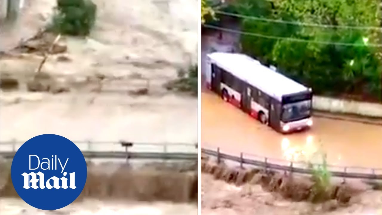 Terrifying moment bus gets swept away by flood water in Italy - The ...
