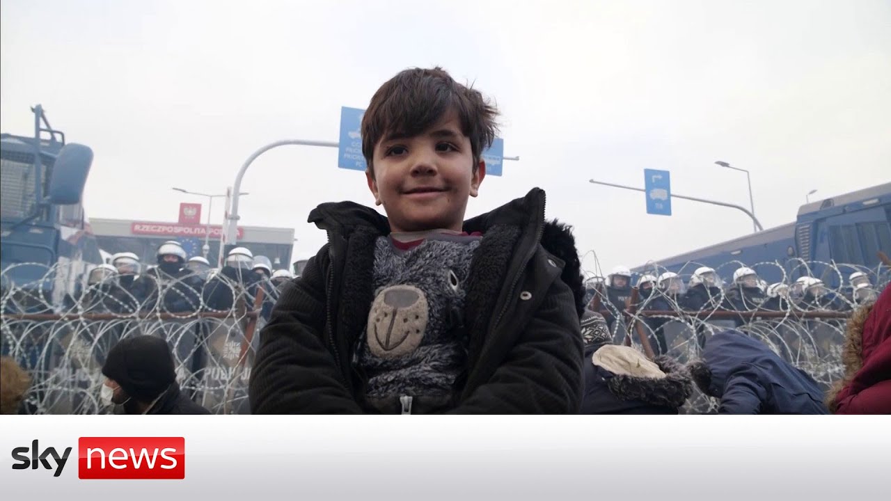 Poland-Belarus border: Migrants huddle for warmth next to razor wire ...