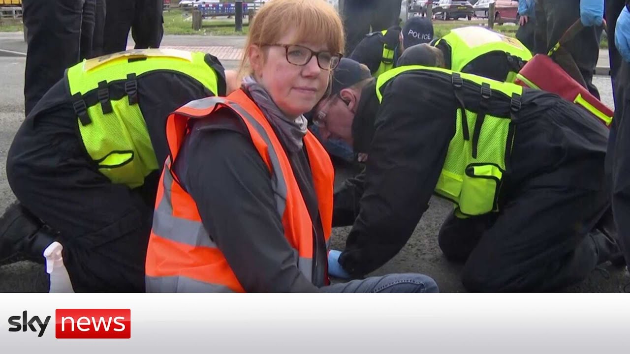 Climate activist interviewed while glued to road - The Global Herald