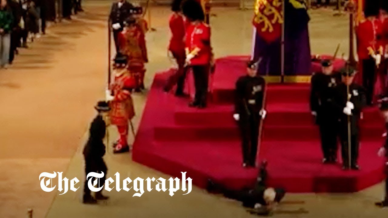 Guard faints while keeping vigil over Queen Elizabeth II's coffin at ...