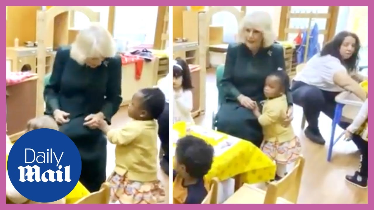 Cute moment Queen Consort Camilla gets a hug from a toddler at nursery ...