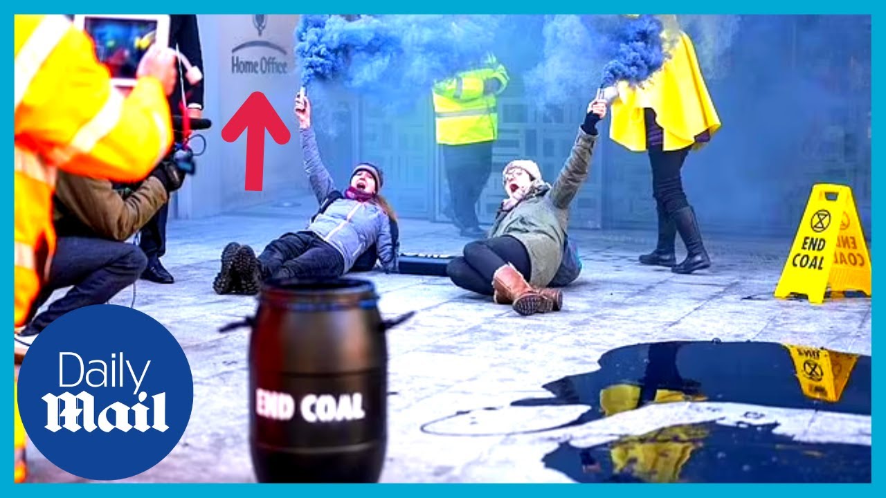 Extinction Rebellion (XR) set off flares by Home Office and douse ...