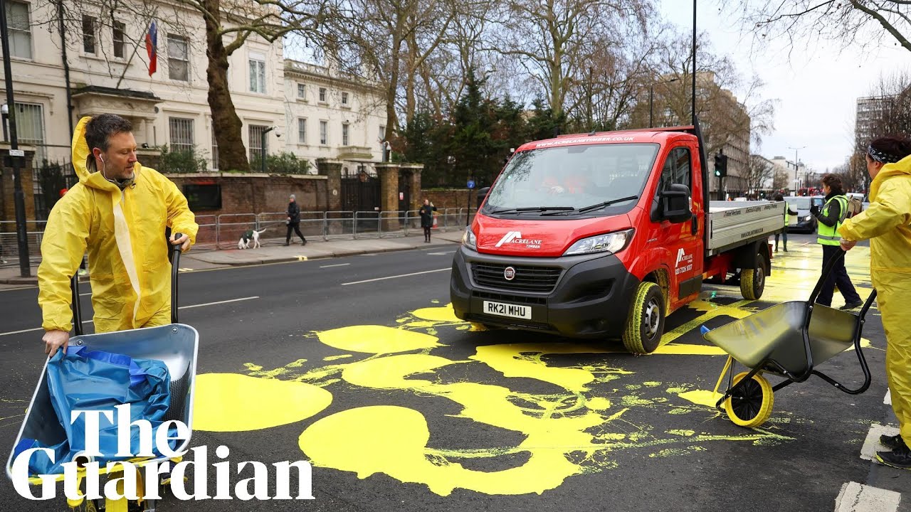 Protesters paint Ukrainian flag outside Russian embassy in London - The ...