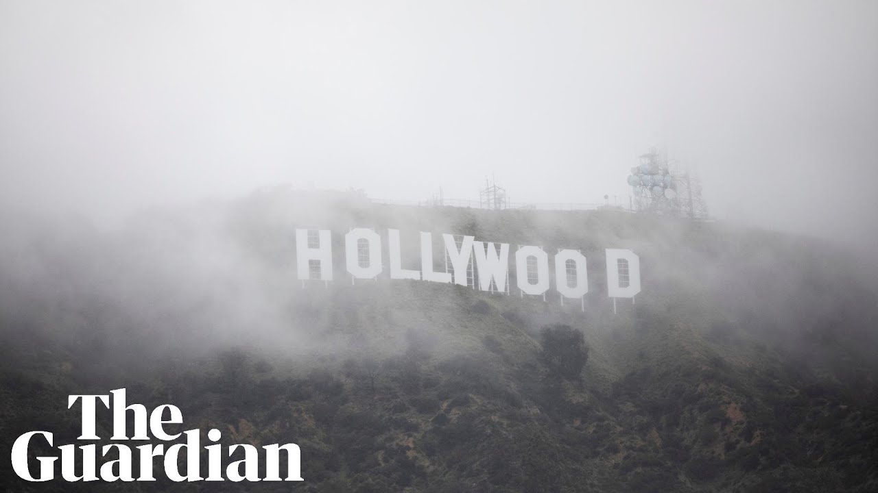 Rare snowfall envelopes southern California, swirling around Hollywood ...