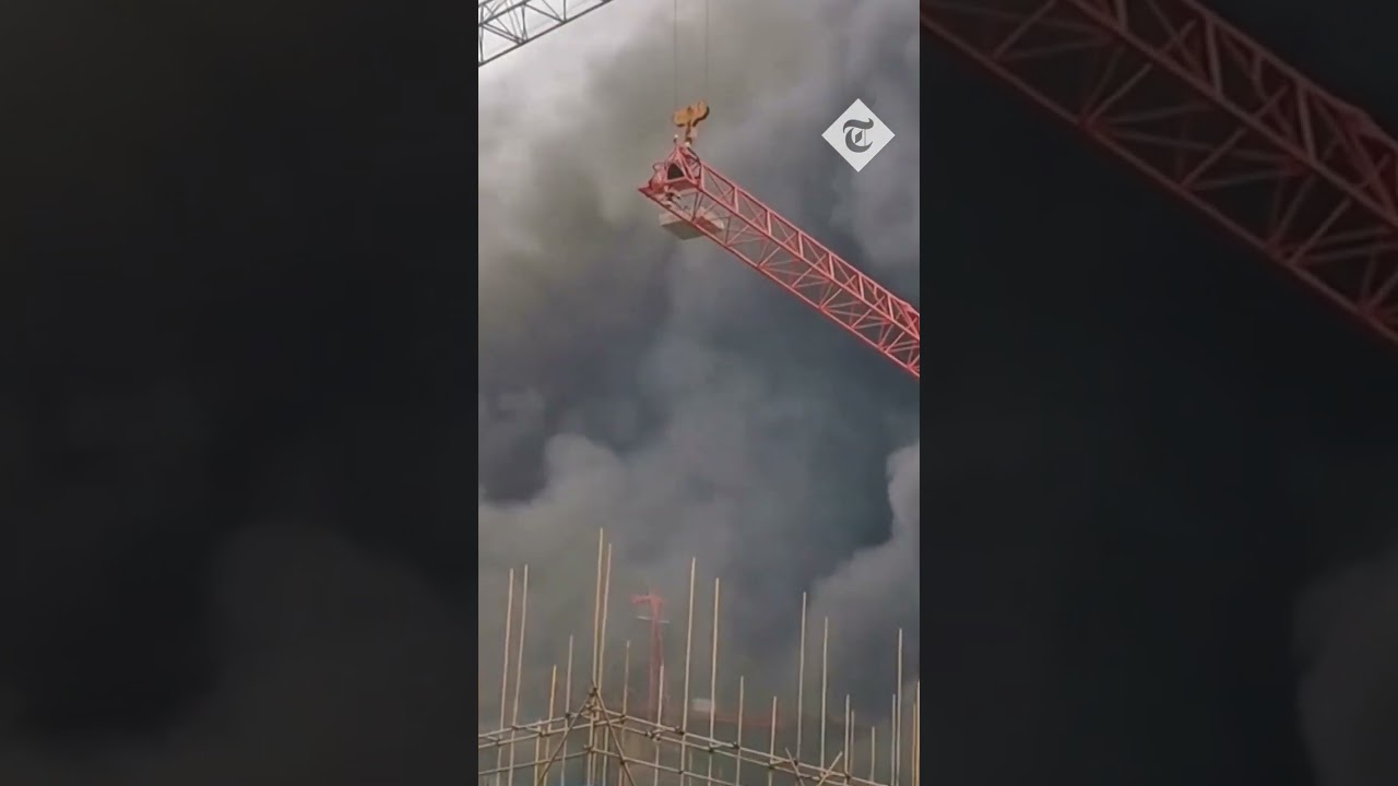 Dramatic moment a worker was rescued from a burning construction site ...