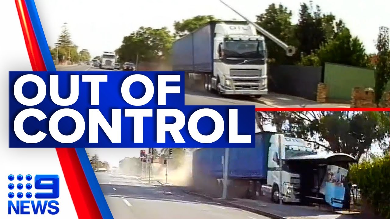Shocking moment out-of-control truck ploughs through busy intersection ...