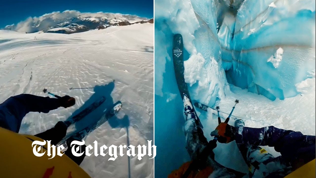 Skier falls down deep glacier cliff and only narrowly avoids falling ...