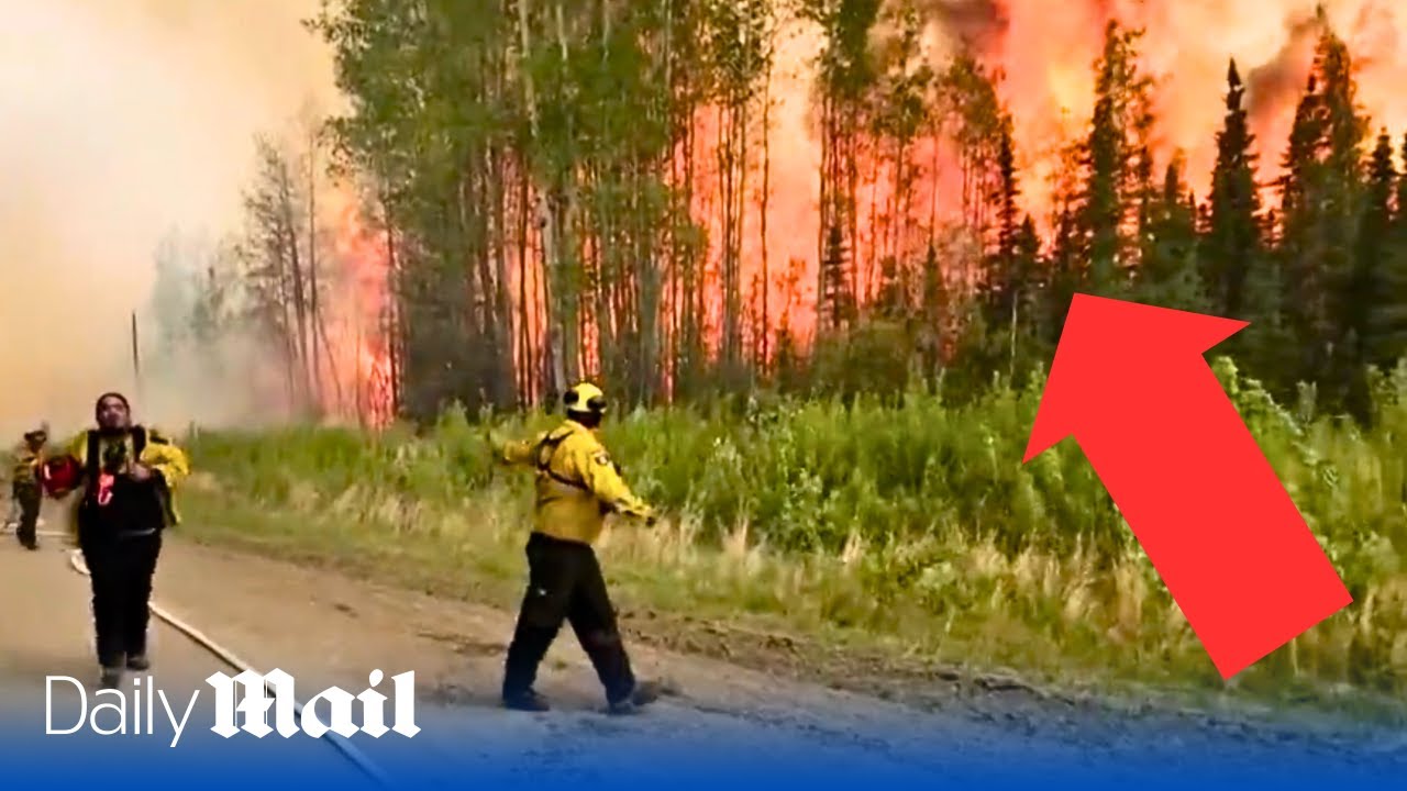 Firefighters run away from massive wildfire in Banff National `Park ...