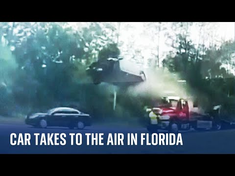 US: Car takes to the air after driving up the ramp of a tow truck at ...