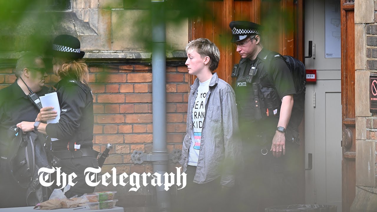 Protestor glues themselves to floor during trans debate at the Oxford ...