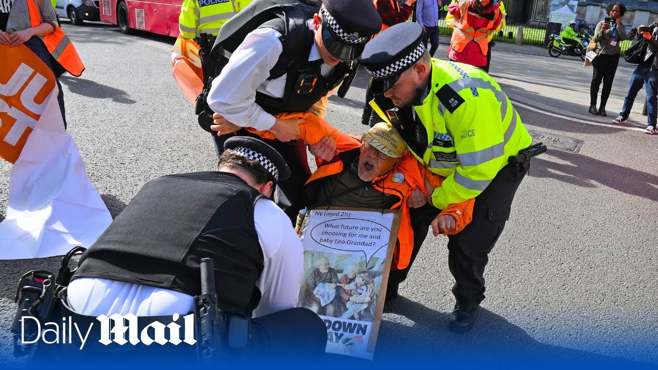 'Get off the road!' Angry police yells at Just Stop Oil protestor - The ...
