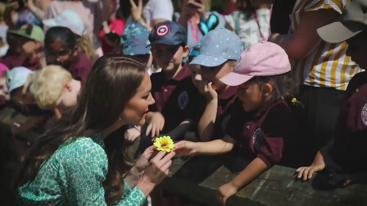 Kate bonds with boy over football on children's centre visit - The ...