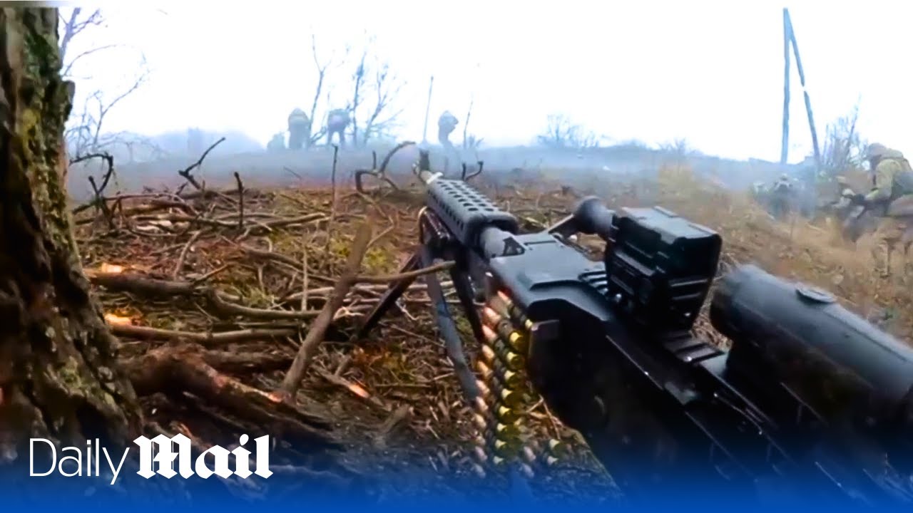 Ukrainian soldiers open fire with machine guns on Russian trenches in ...