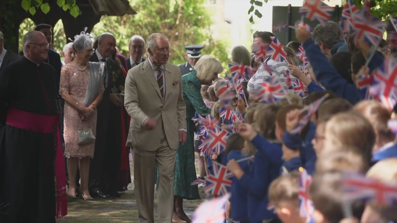 Flag waving school children welcome King and Queen to Wales - The ...