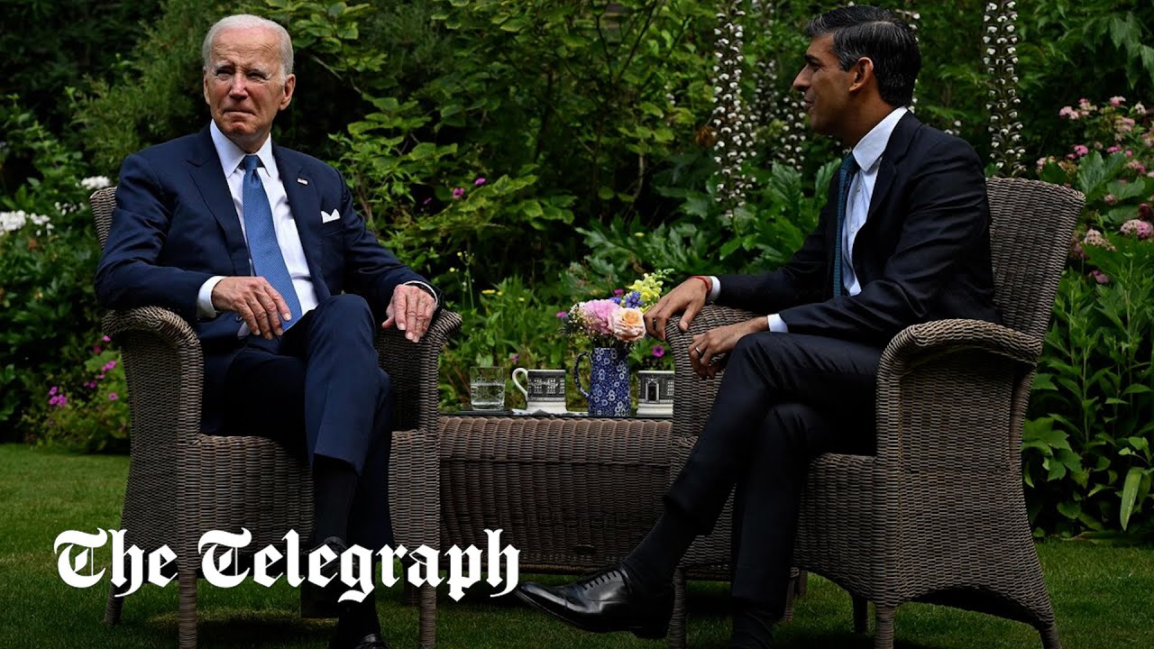 Joe Biden holds cue cards during meeting with Rishi Sunak at Downing ...