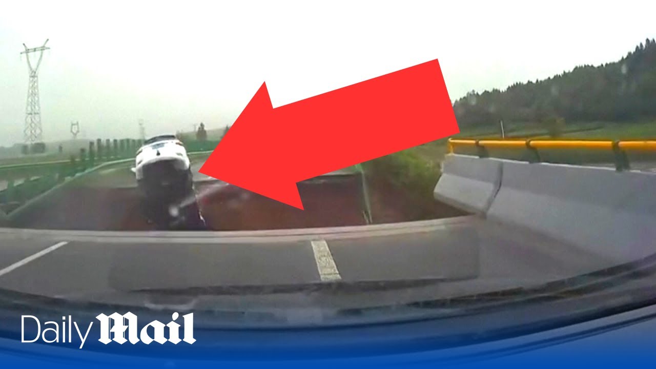Terrifying moment car drives off collapsed bridge in China amid severe ...