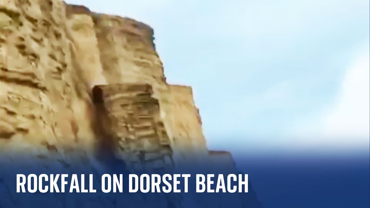 Dorset: Rockfall on a beach narrowly misses people walking below - The ...