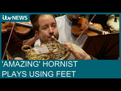 Artist born without arms who plays the French horn with his feet to ...
