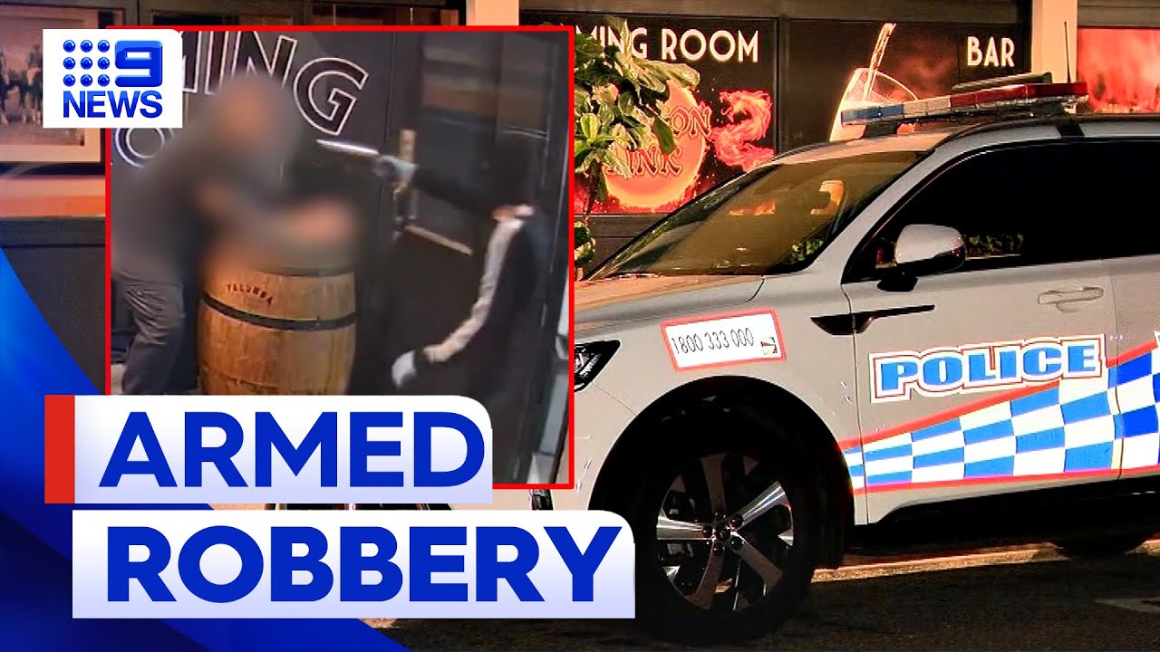 CCTV footage shows security guard held up at gunpoint | 9 News ...