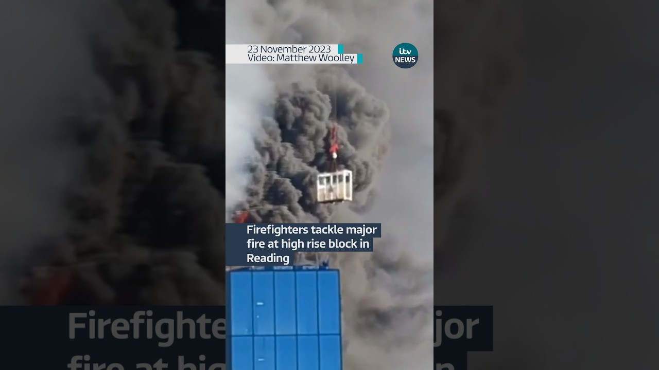 A crane rescues a worker next to a burning high rise in Reading # ...