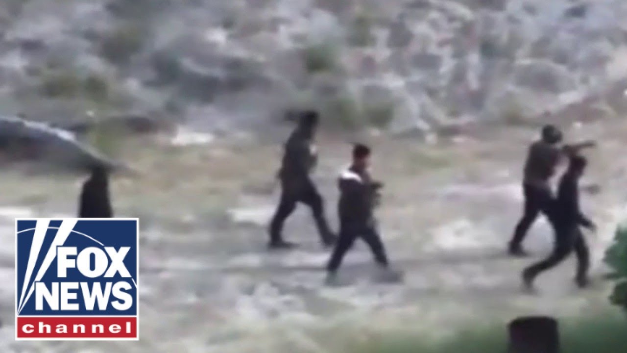 'Shocking' video shows armed cartel members scaling southern border ...