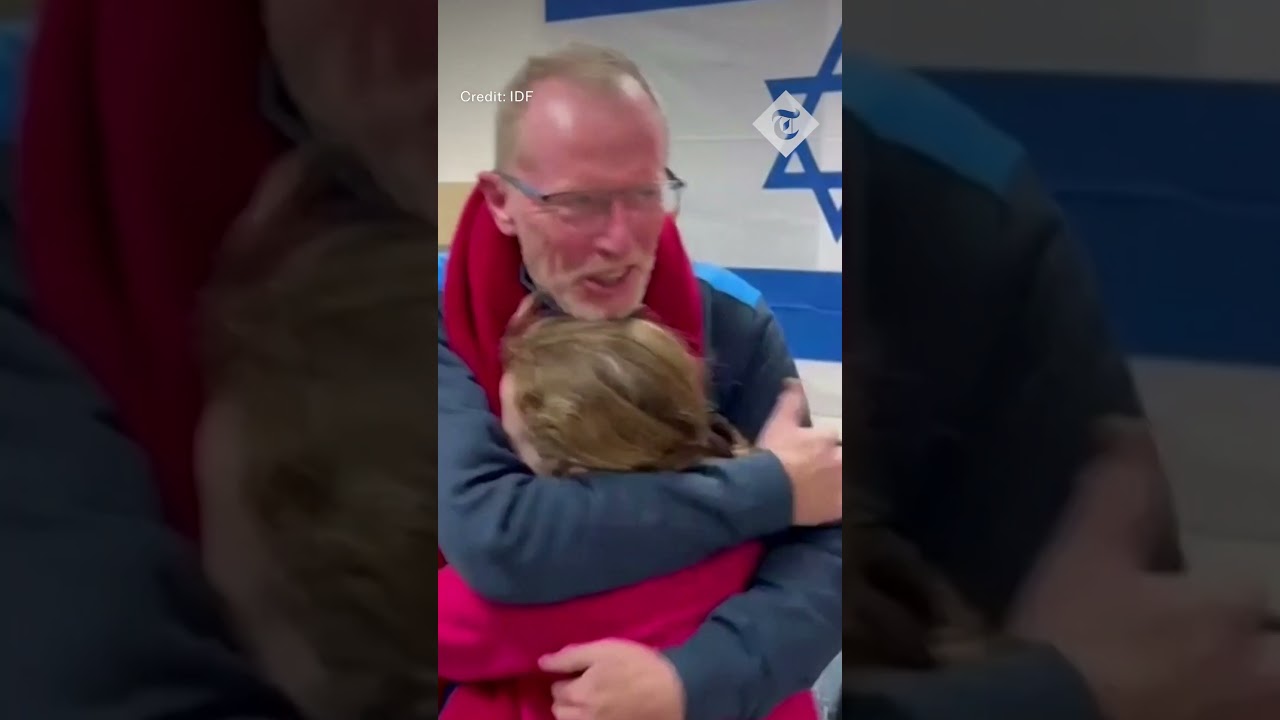 Moment Emily Hand is reunited with her father, after being held hostage ...