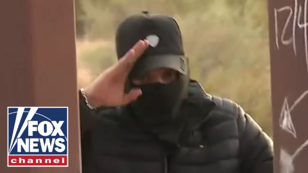 Human smuggler salutes camera at southern border - The Global Herald
