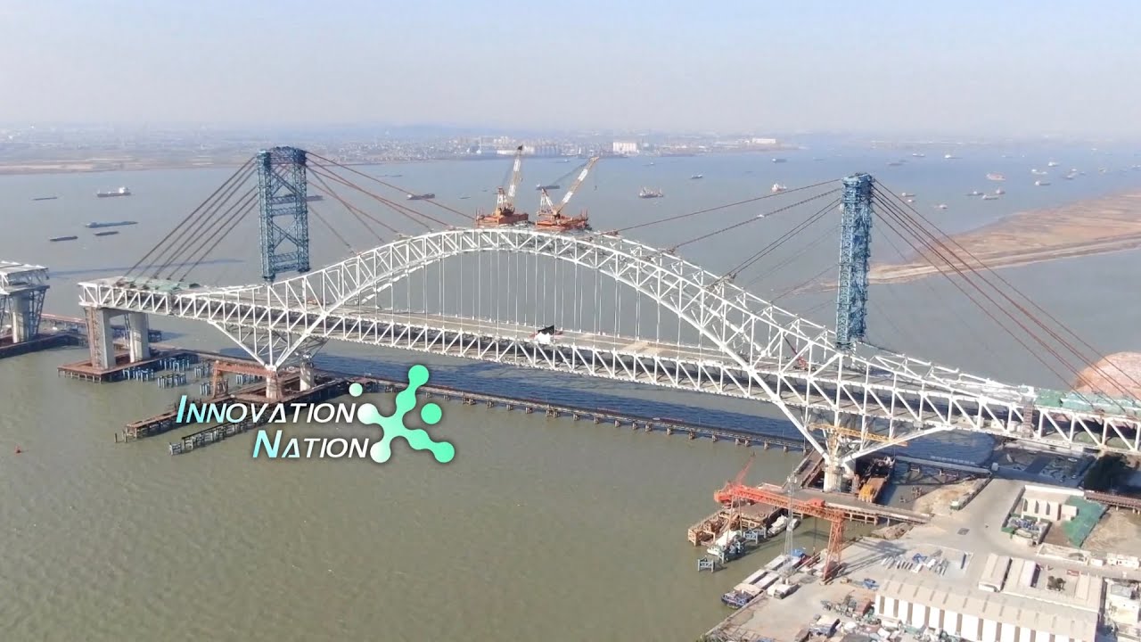 World's largest steel-trussed arch bridge combining highway, railway ...