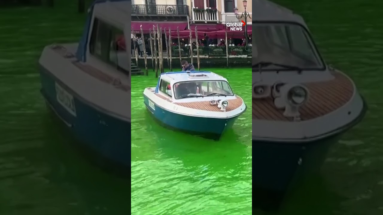 Venice's Grand Canal turns green as climate change activists demand ...